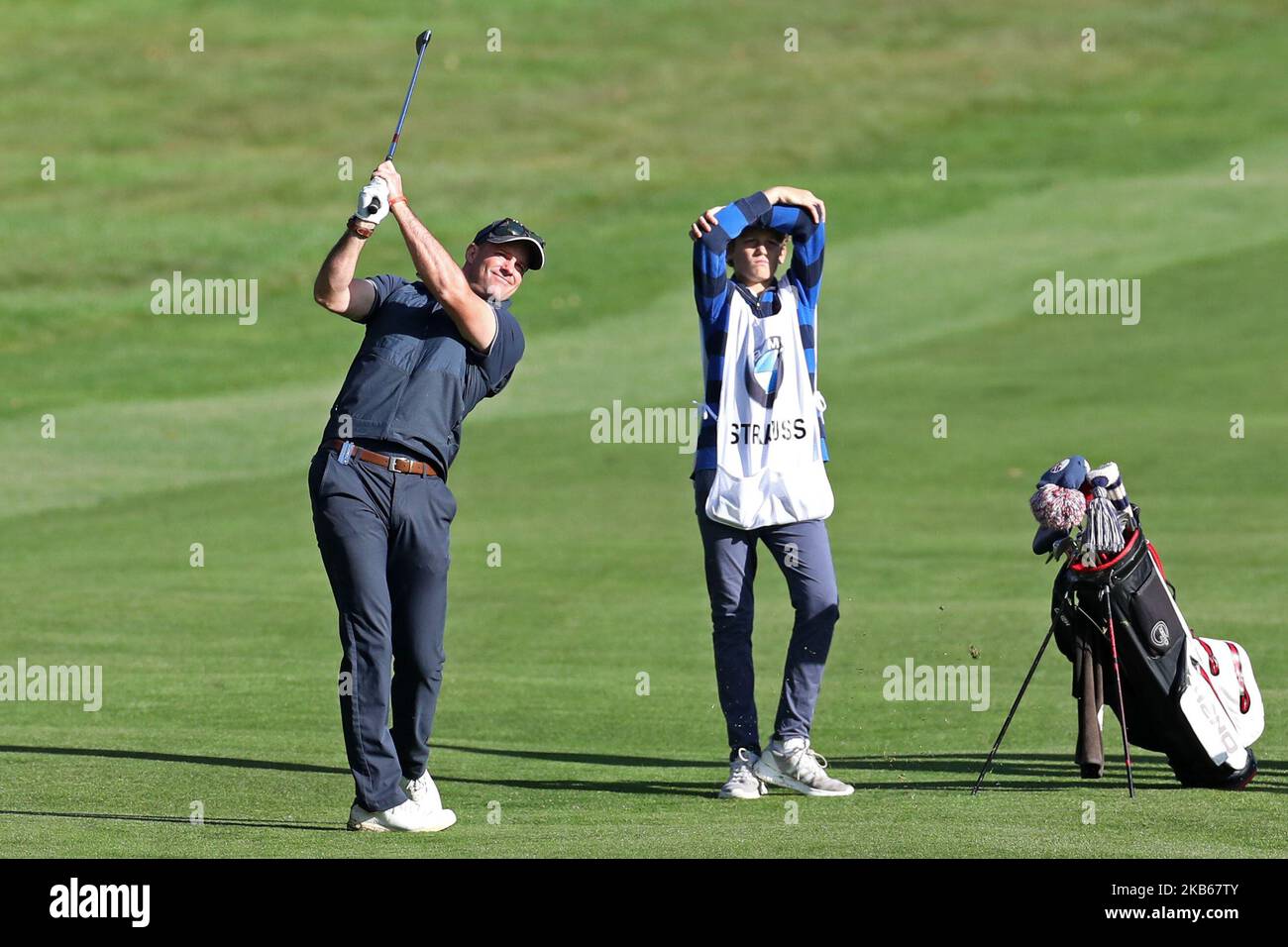 Sir Andrew Strauss with his son Sam caddying during the BMW PGA ...