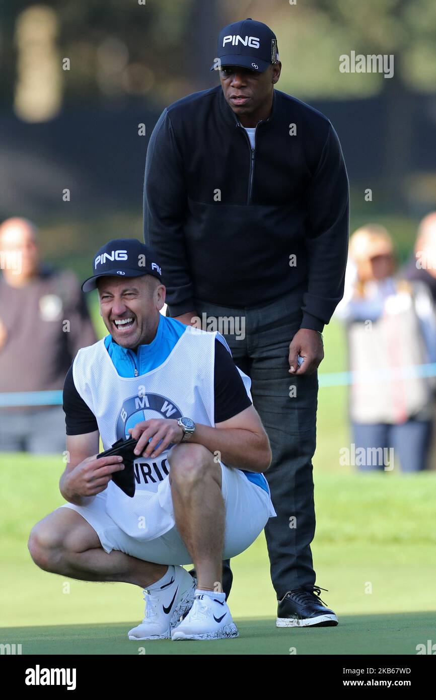 Ian Wright has a laugh with his caddie during the BMW PGA Championship ...