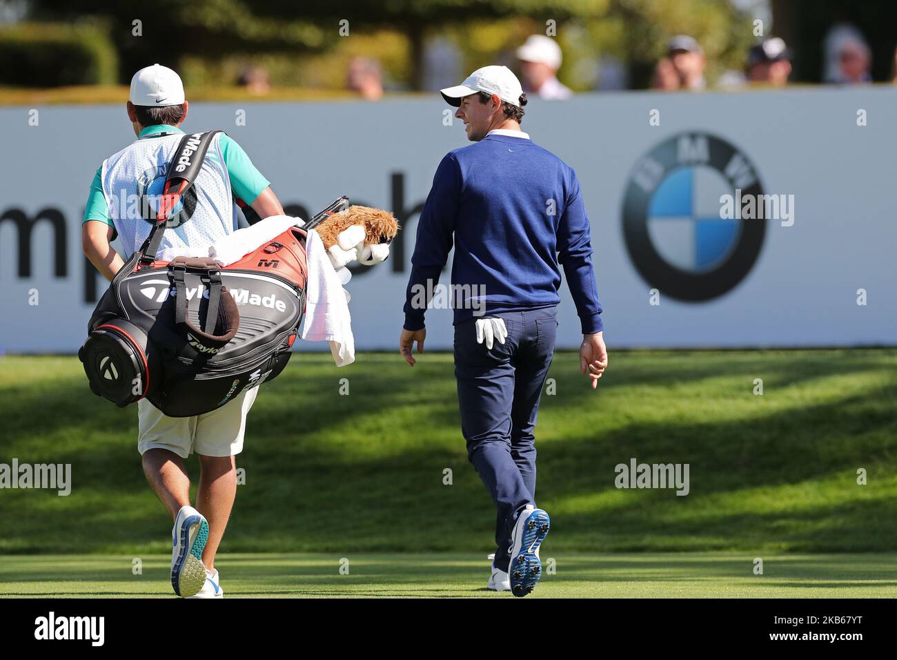 Rory McIlroy walks down the fairway with his caddie during the BMW PGA Championship Pro Am at ...