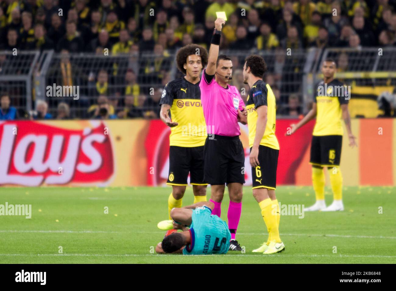 Ovidiu Hategan, referee shows the yellow card during the UEFA Champions ...