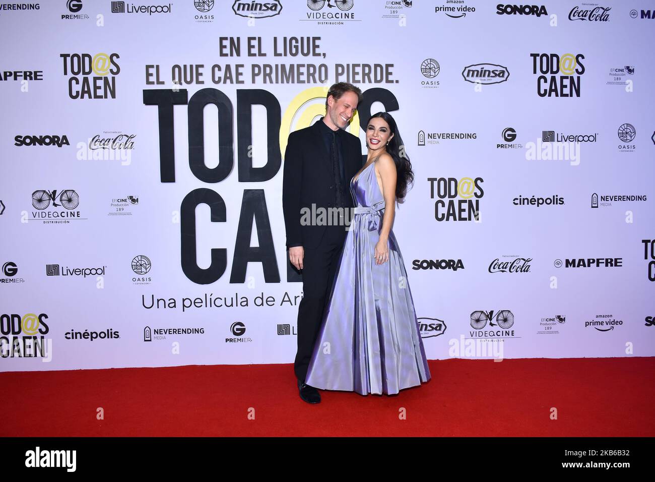 Martha Higareda, Cory Brusseau poses for photos during 'Todos Caen' film premiere at Cinepolis ...