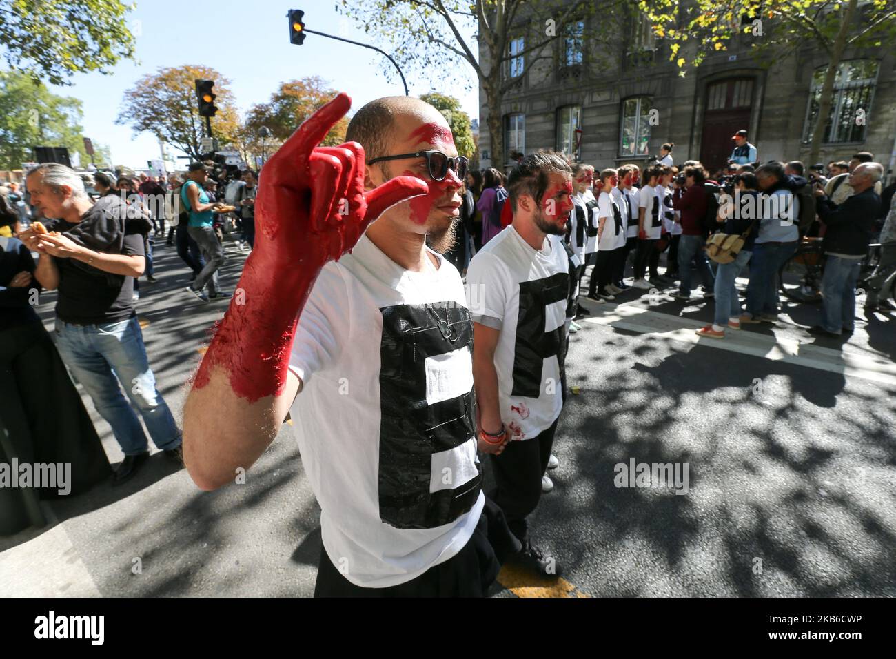 Students, teachers and environmentalists take part in a protest to draw ...