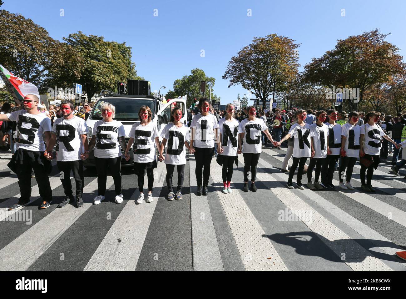 Students, teachers and environmentalists take part in a protest to draw ...