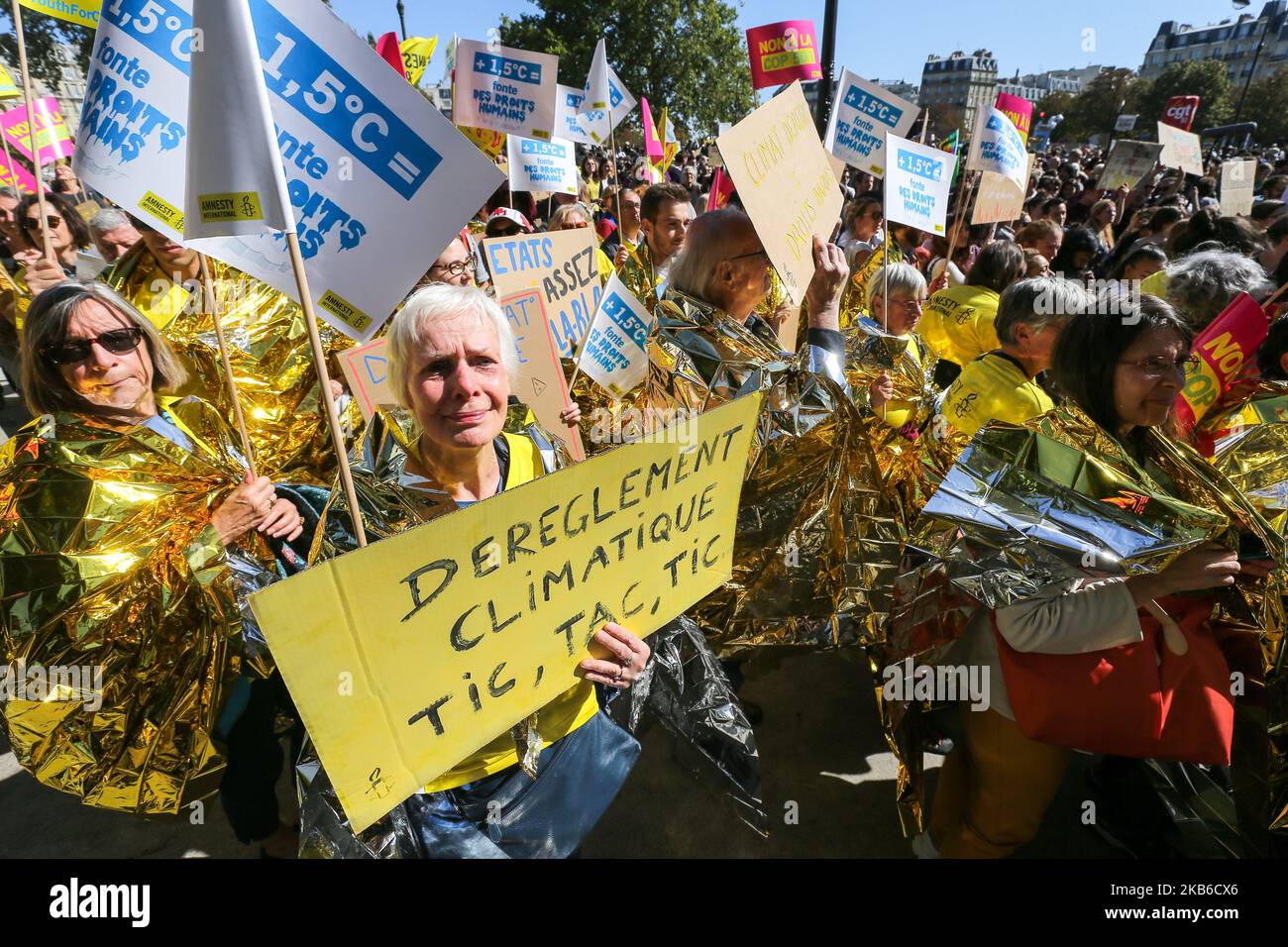 Students, teachers and environmentalists take part in a protest to draw ...