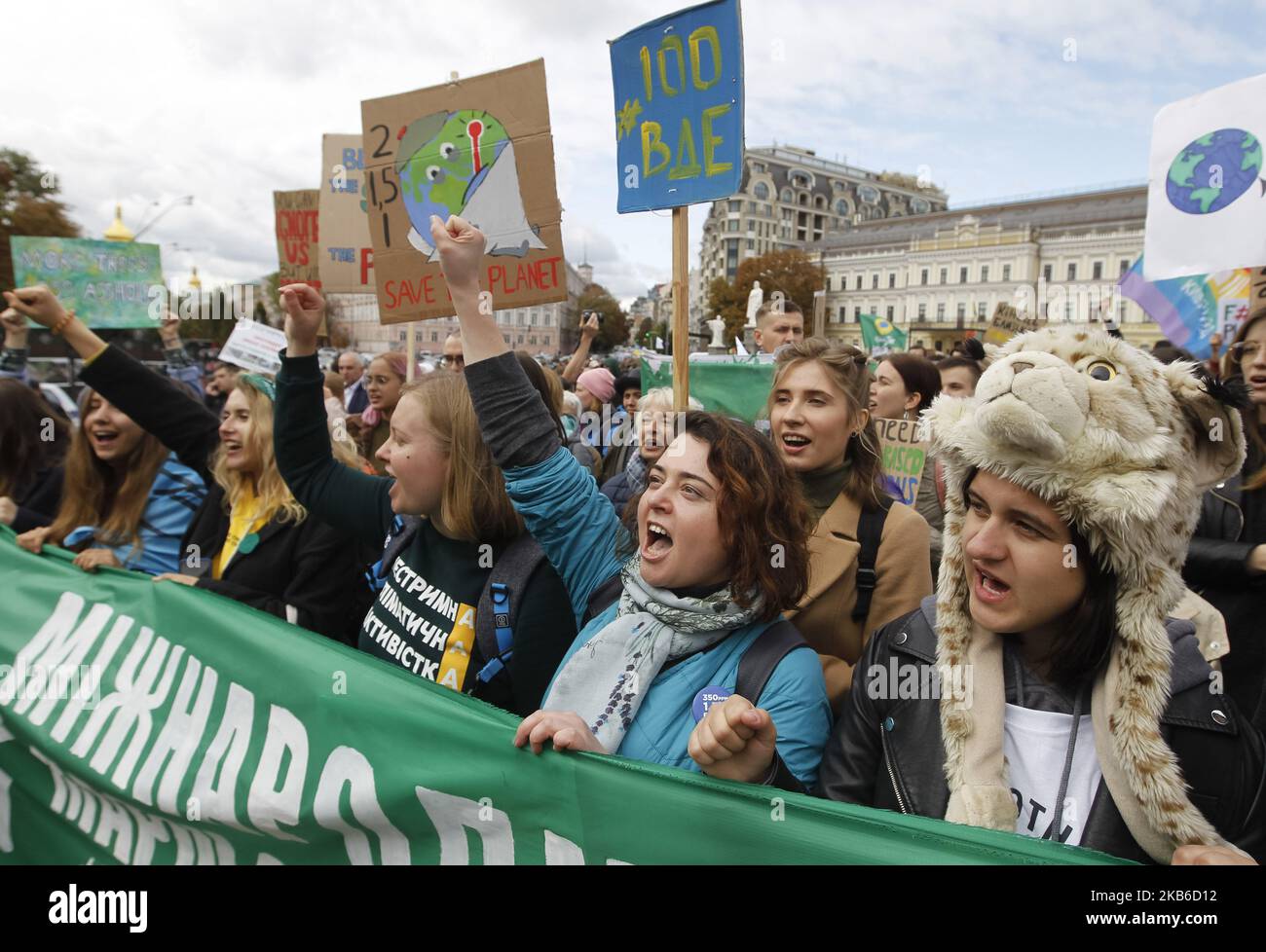 Youth hold posters and shout slogans during the 'Global climate strike ...