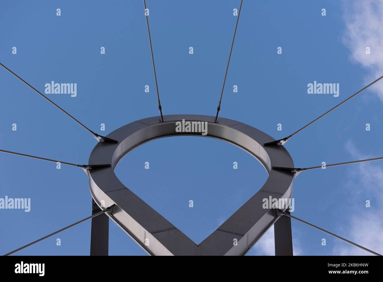 large elevated metal structure with steel cables viewed from below ...