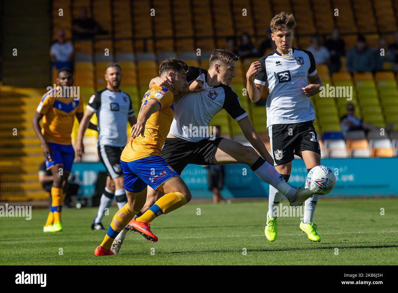 Adam Crookes of Port Vale holds off Otis Khan of Mansfield Town during ...