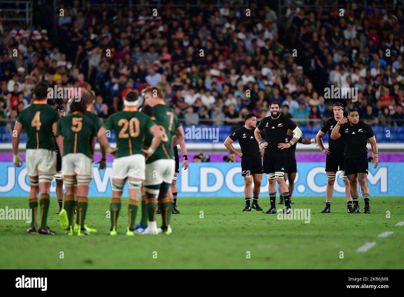 All Black player waiting the Springboks player to play their line out ...