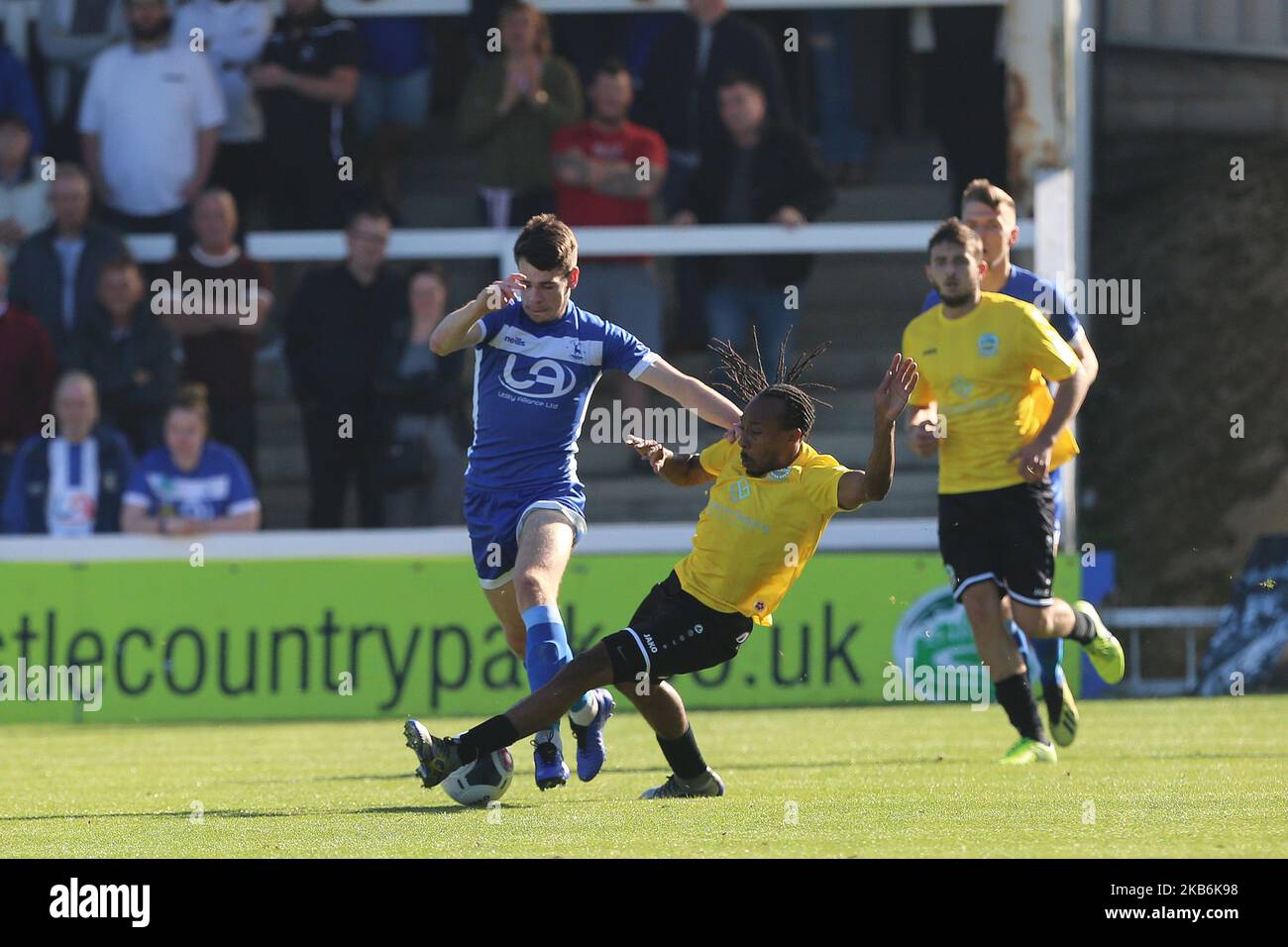 Ricky Modeste of Dover Athletic tackles Hartlepool United's Aaron ...