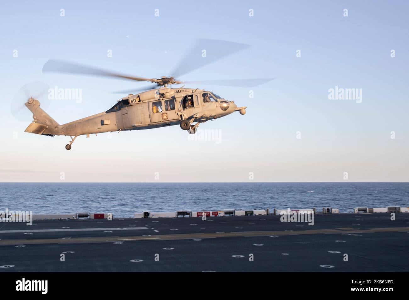 221102-N-EU502-3033 WESTERN PACIFIC OCEAN (Nov. 2, 2022) – An MH-60S ...