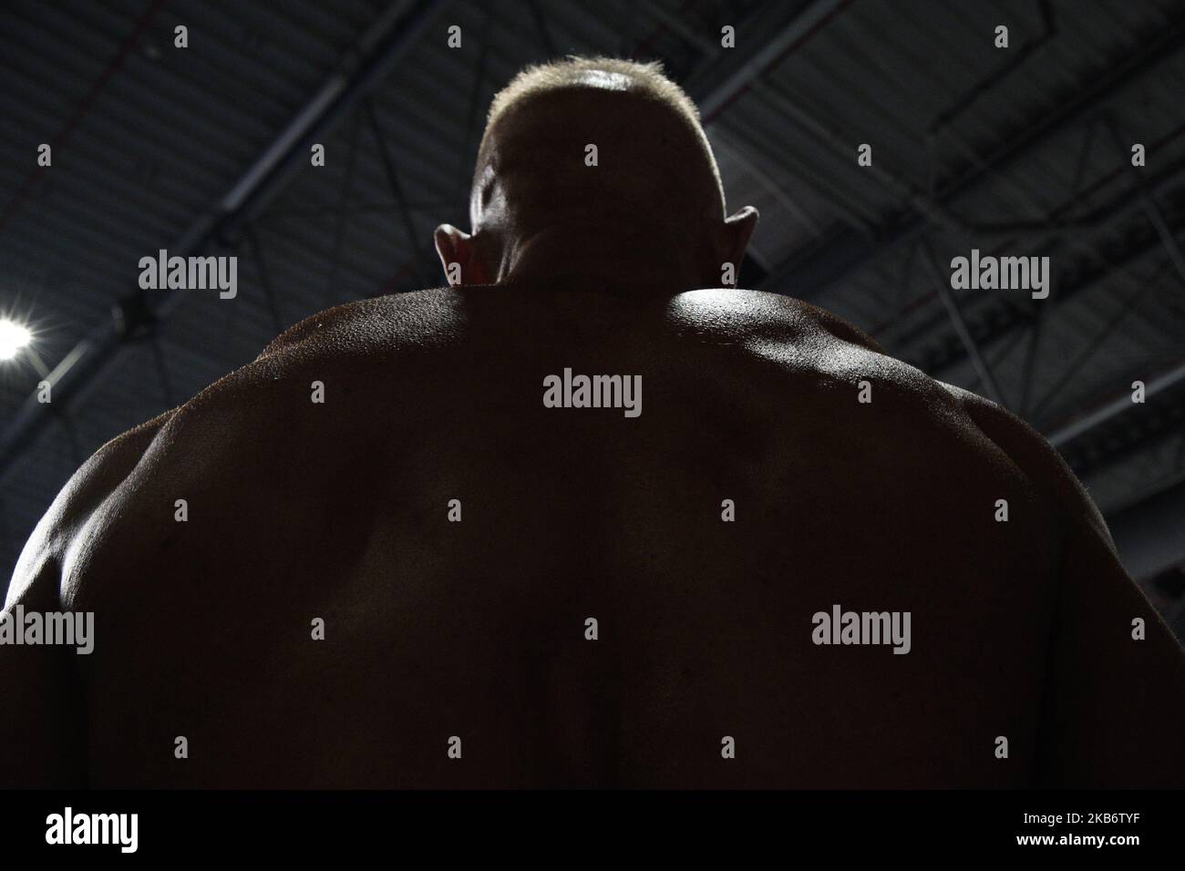 A body builder is seen getting ready for competition during the FIWE ...