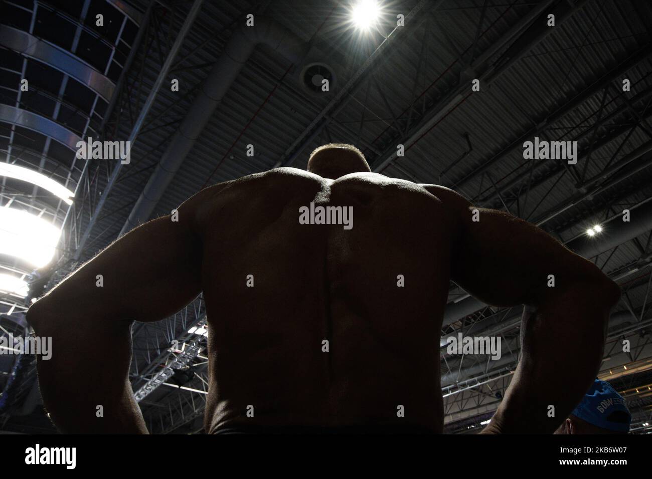 A body builder is seen getting ready for competition during the FIWE ...