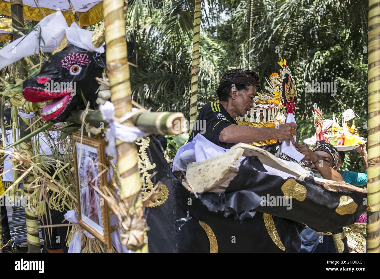 Balinese Hindu prepares the coffin during mass cremation or locally ...