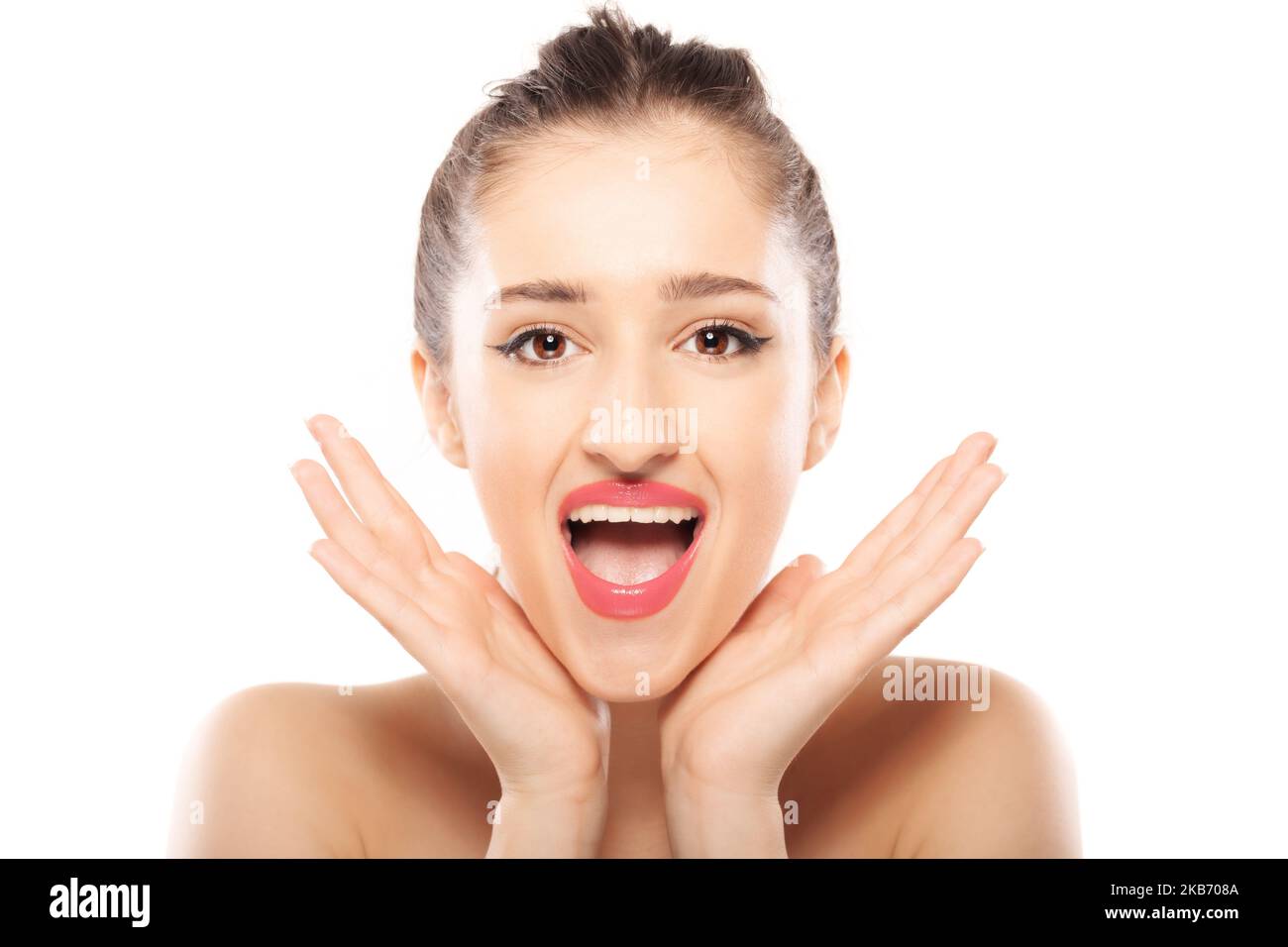 Beautiful girl studio portrait. Making hand gestures and face ...