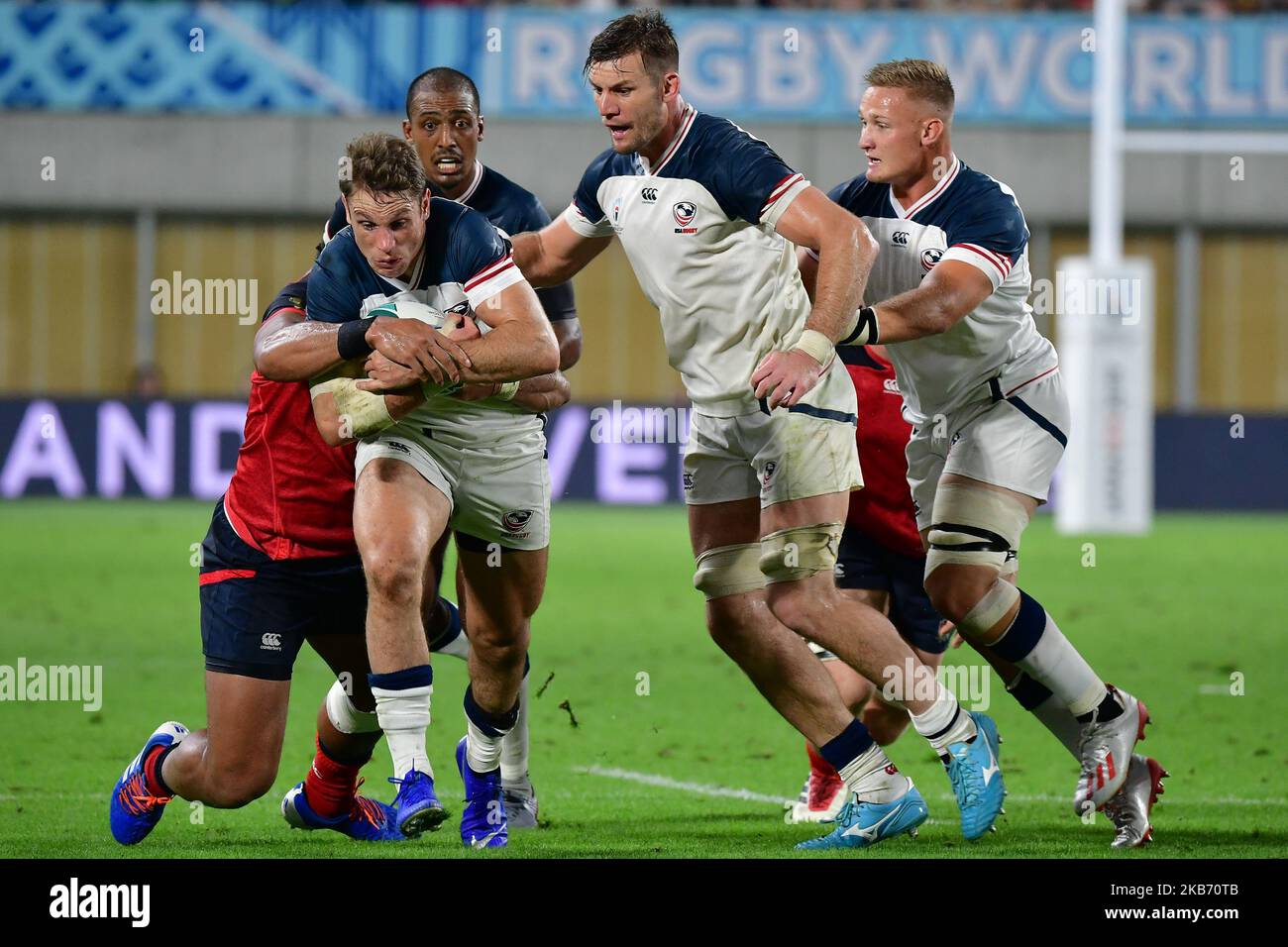 Photo action of Blaine Scully (c) passes the England defend during ...