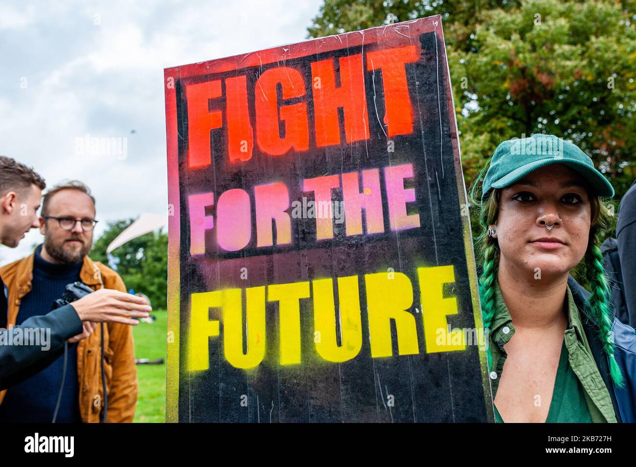 School students and activists gather during a climate strike march on ...