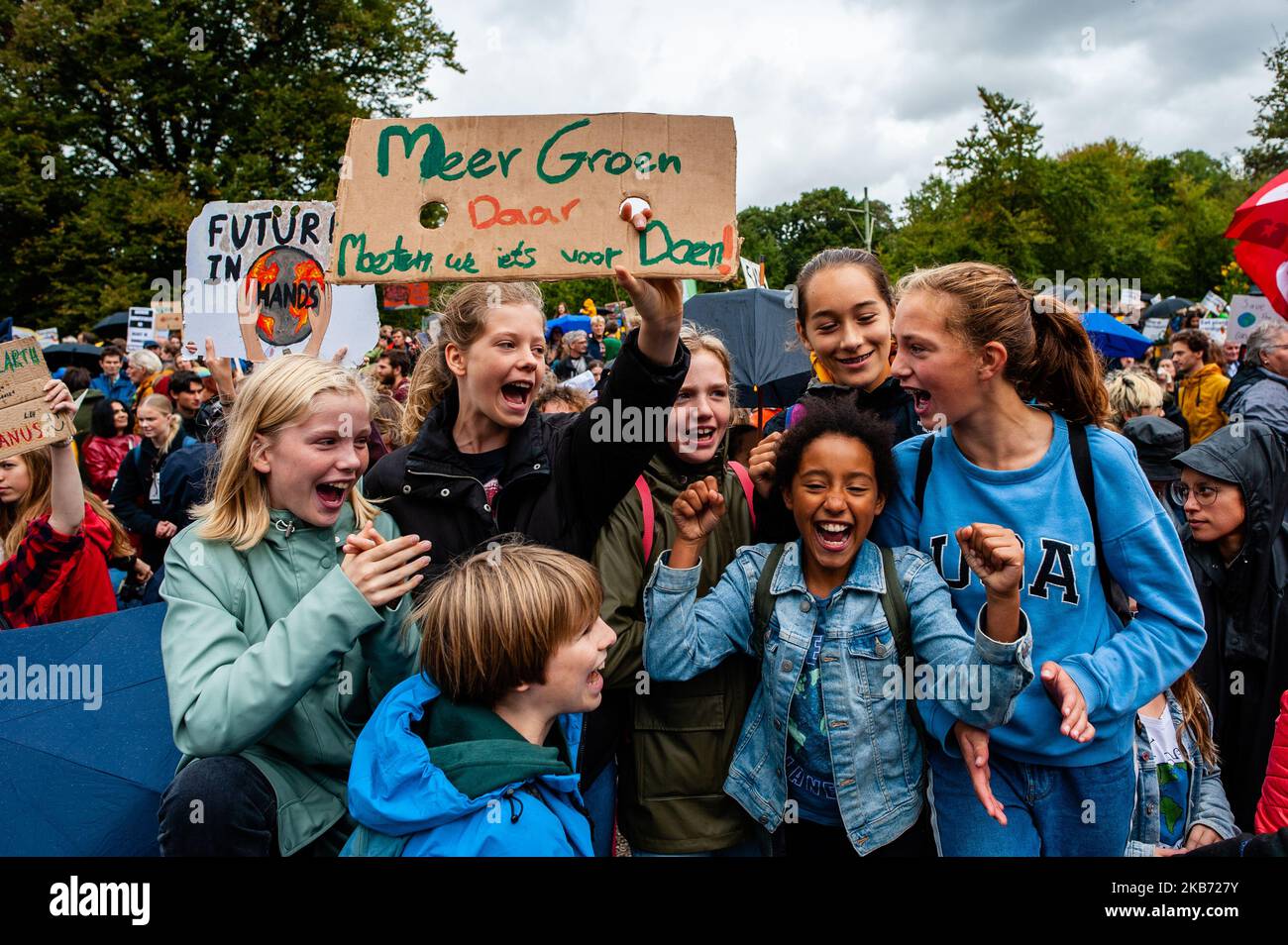 School students and activists gather during a climate strike march on ...