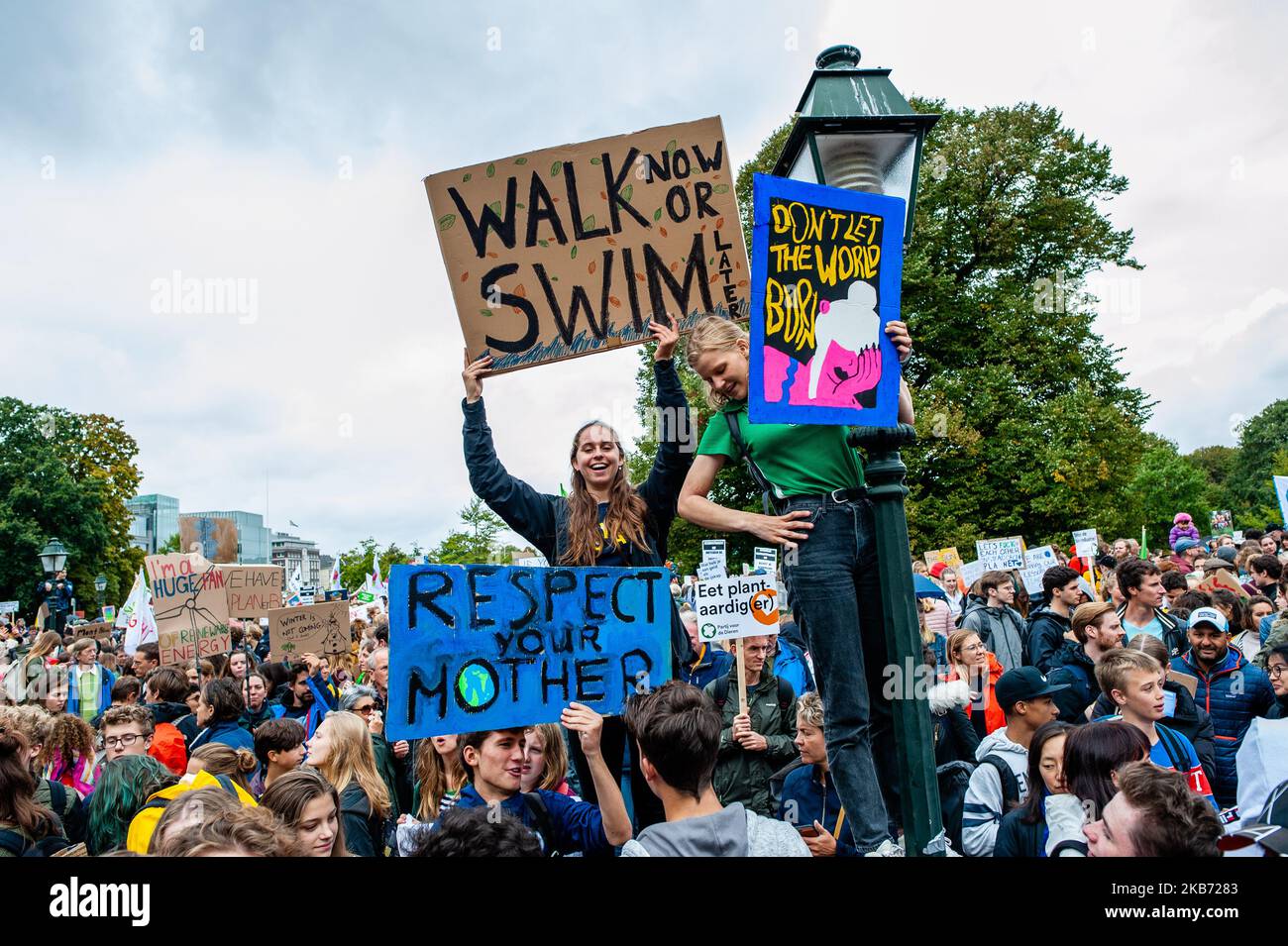 School students and activists gather during a climate strike march on ...