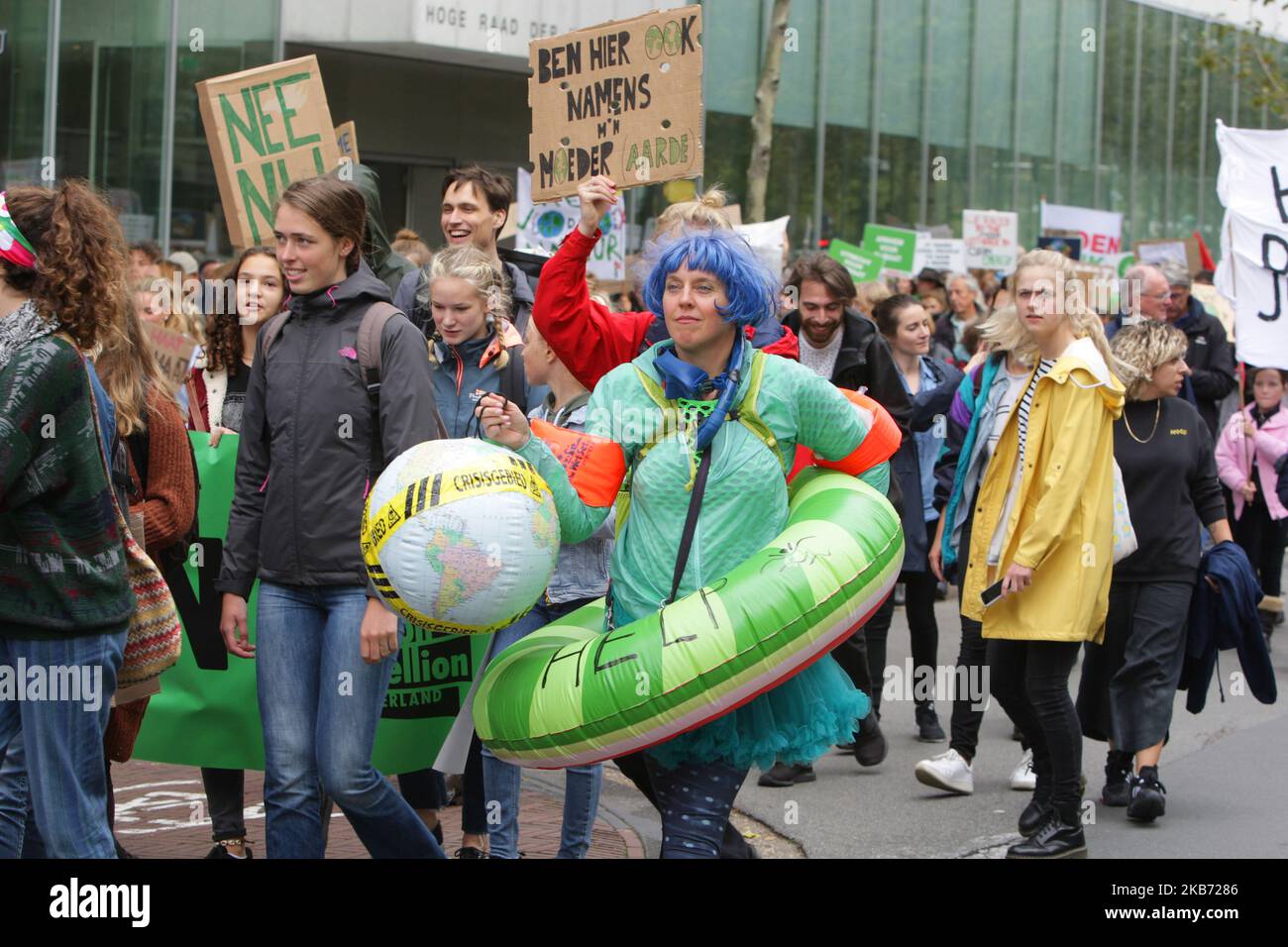School students and activists gather during a climate strike march on ...