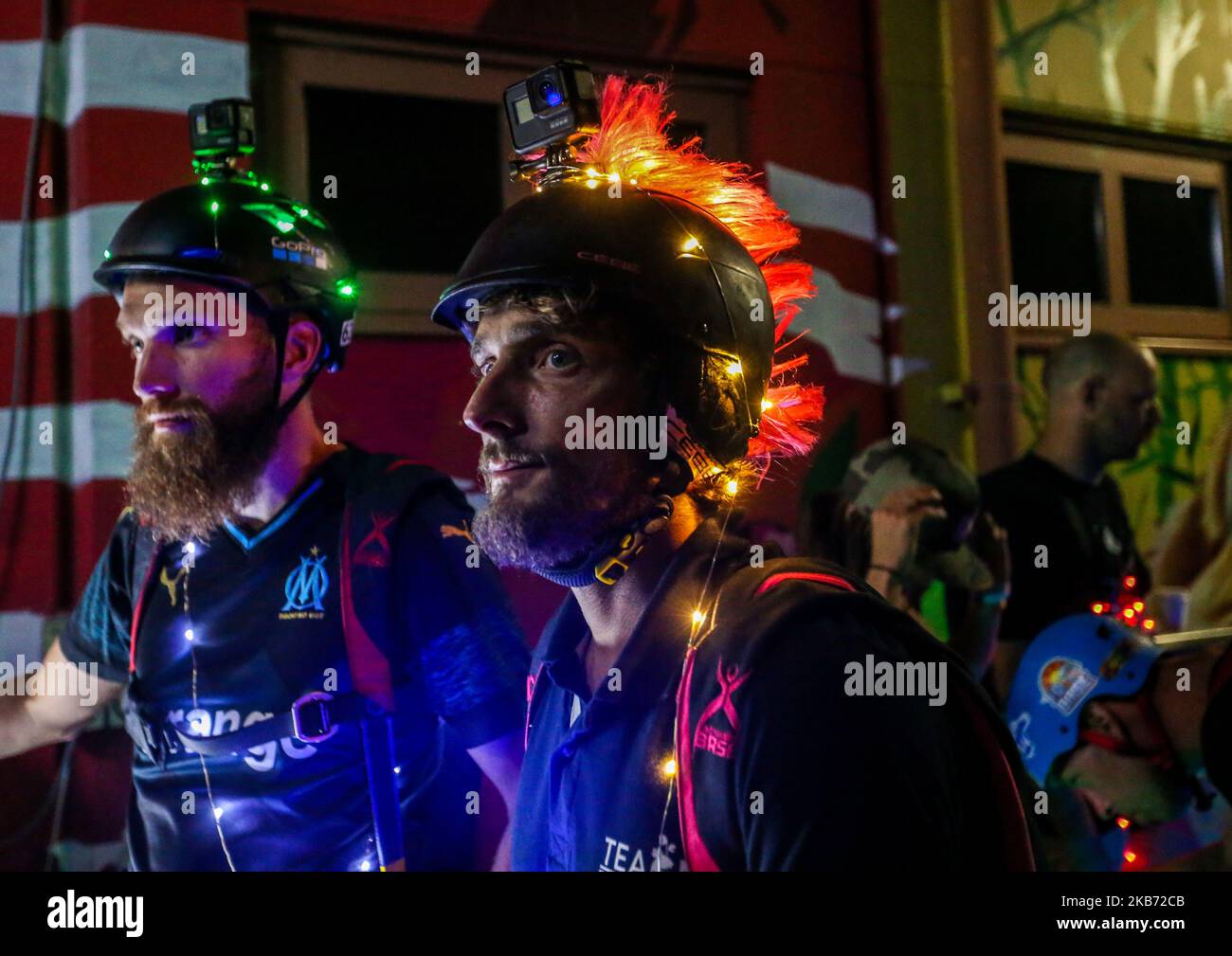 Base jumpers prepare to leap from the 300-metre (984 ft.) high open ...