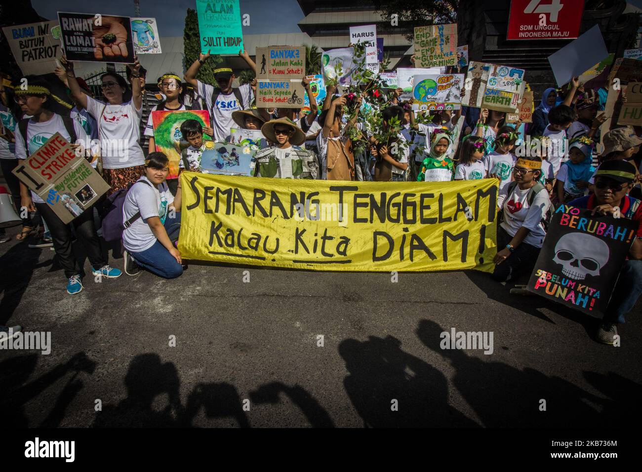 Disabled people and environmental activists holding banners and posters ...