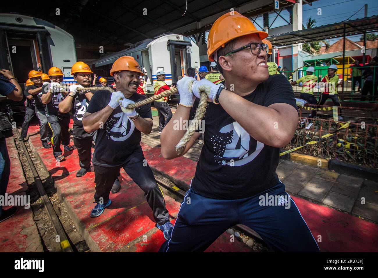 Participants take part in a train-pulling competition at local ...