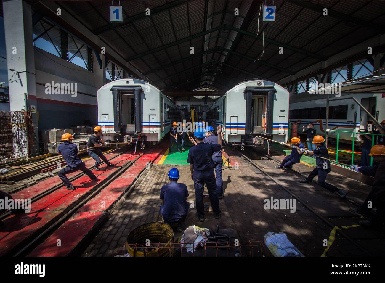 Participants take part in a train-pulling competition at local ...