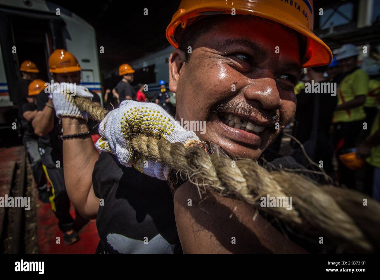 Participants take part in a train-pulling competition at local ...
