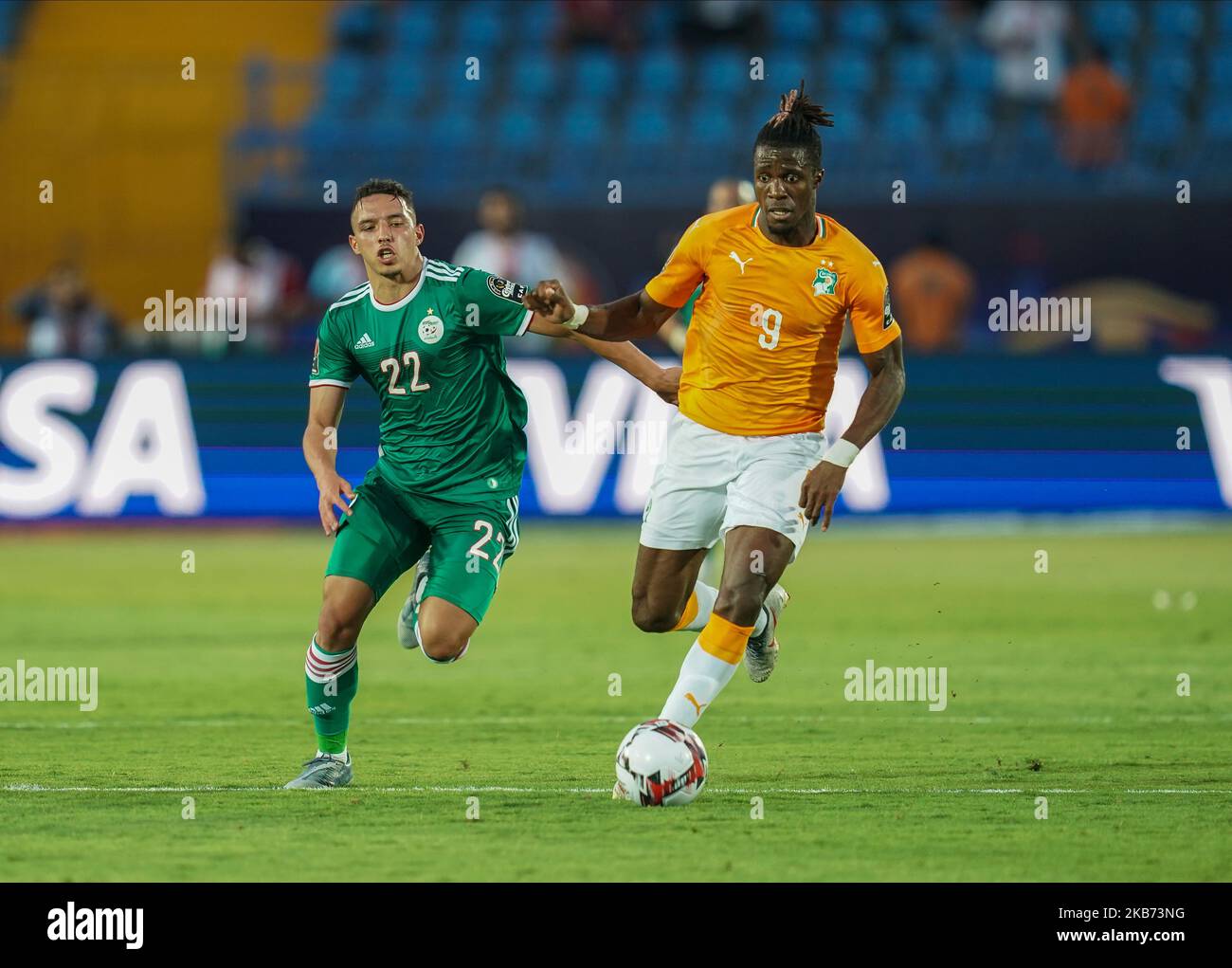 Dazet Wilfried Armel Zaha of Cote D’ivoire and Ismael Bennacer of ...