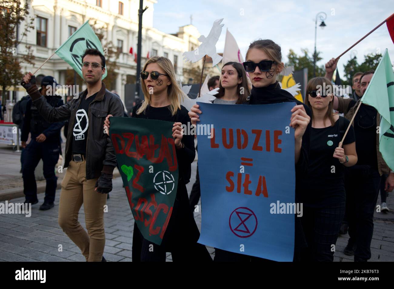 Extinction Rebellion activists are seen performing as Red Rebellion ...