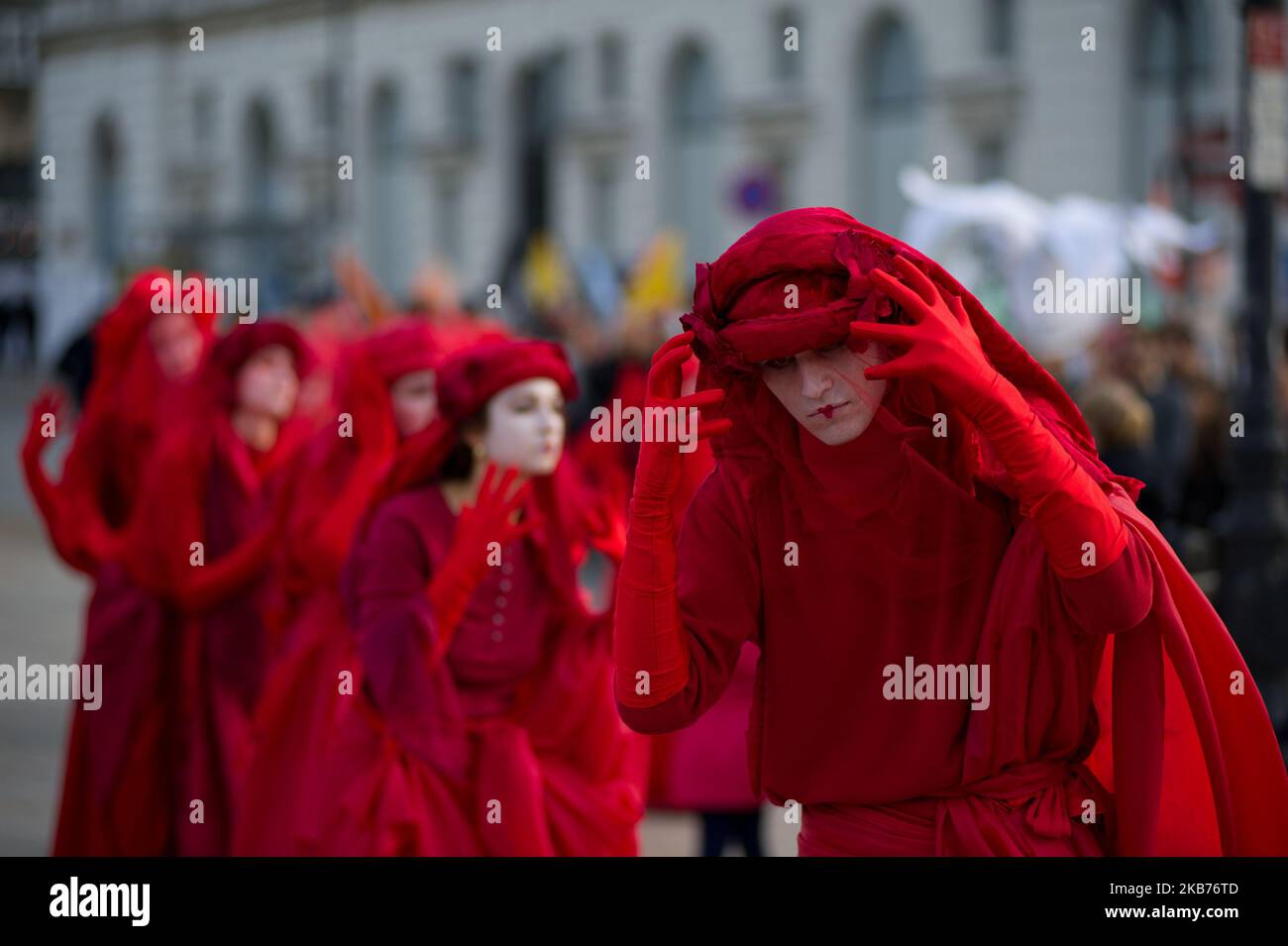 Extinction Rebellion activists are seen performing as Red Rebellion ...