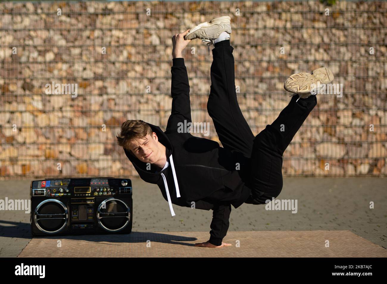Breakdance dancer.A boy in breakdance position. A dancer in a difficult ...