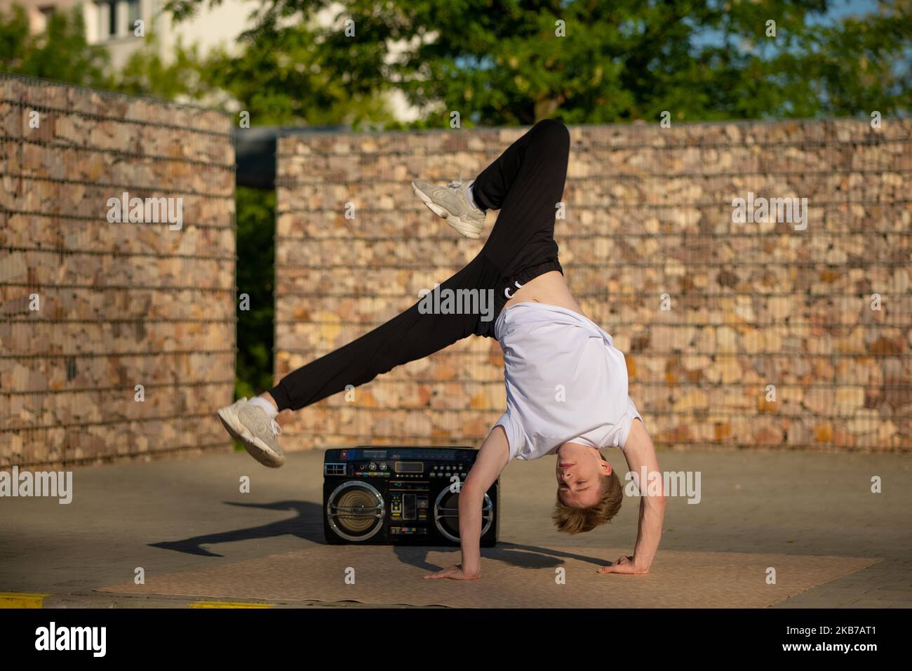 Breakdance dancer.A boy in breakdance position. A dancer in a difficult ...