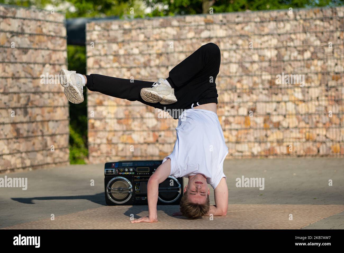 Breakdance dancer.A boy in breakdance position. A dancer in a difficult ...