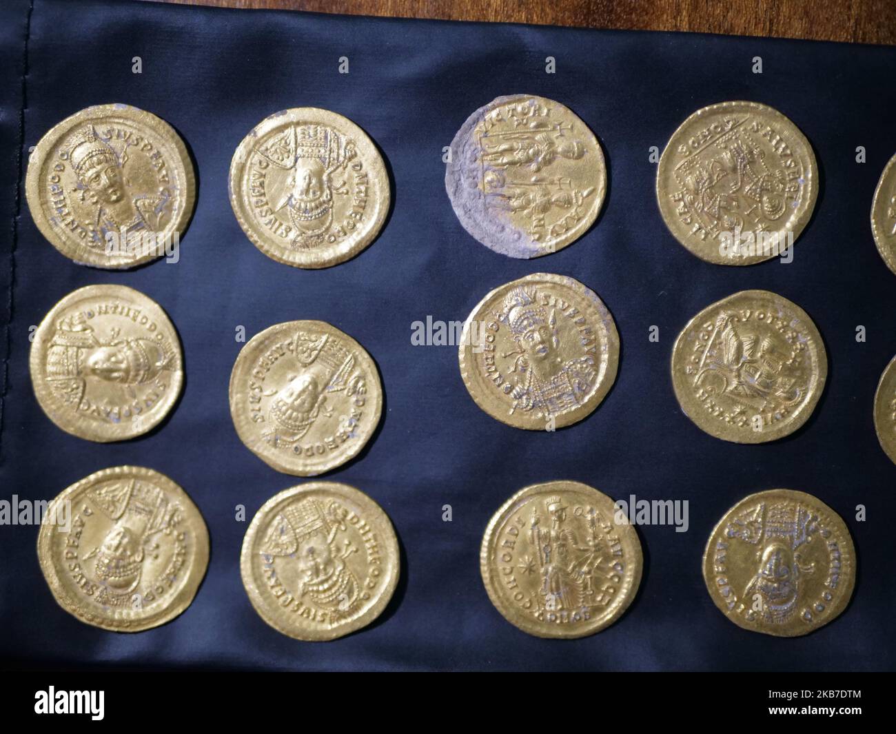 The archaeologist Hristo Kuzov shows golden coins, discovered during ...
