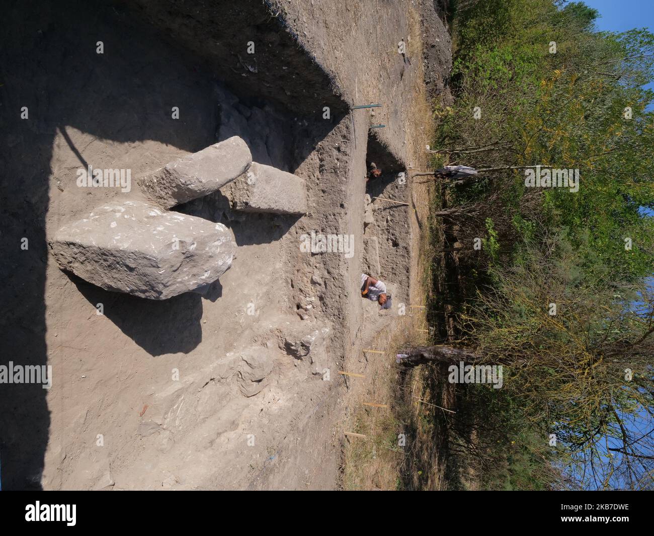 The archaeologist Hristo Kuzov shows golden coins, discovered during ...
