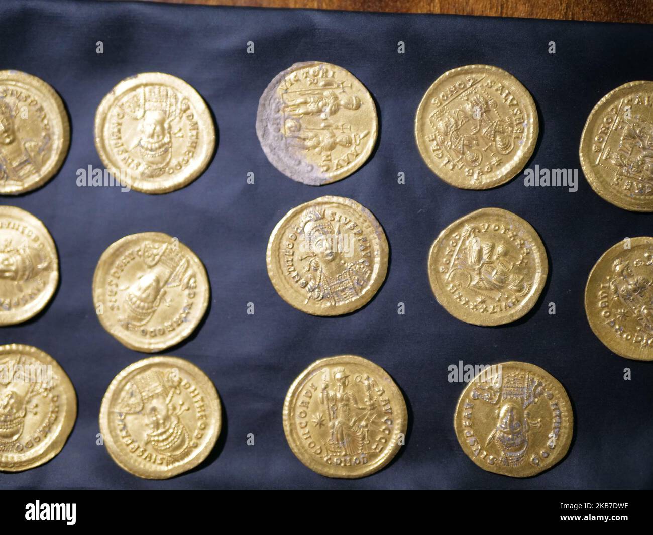 The archaeologist Hristo Kuzov shows golden coins, discovered during ...