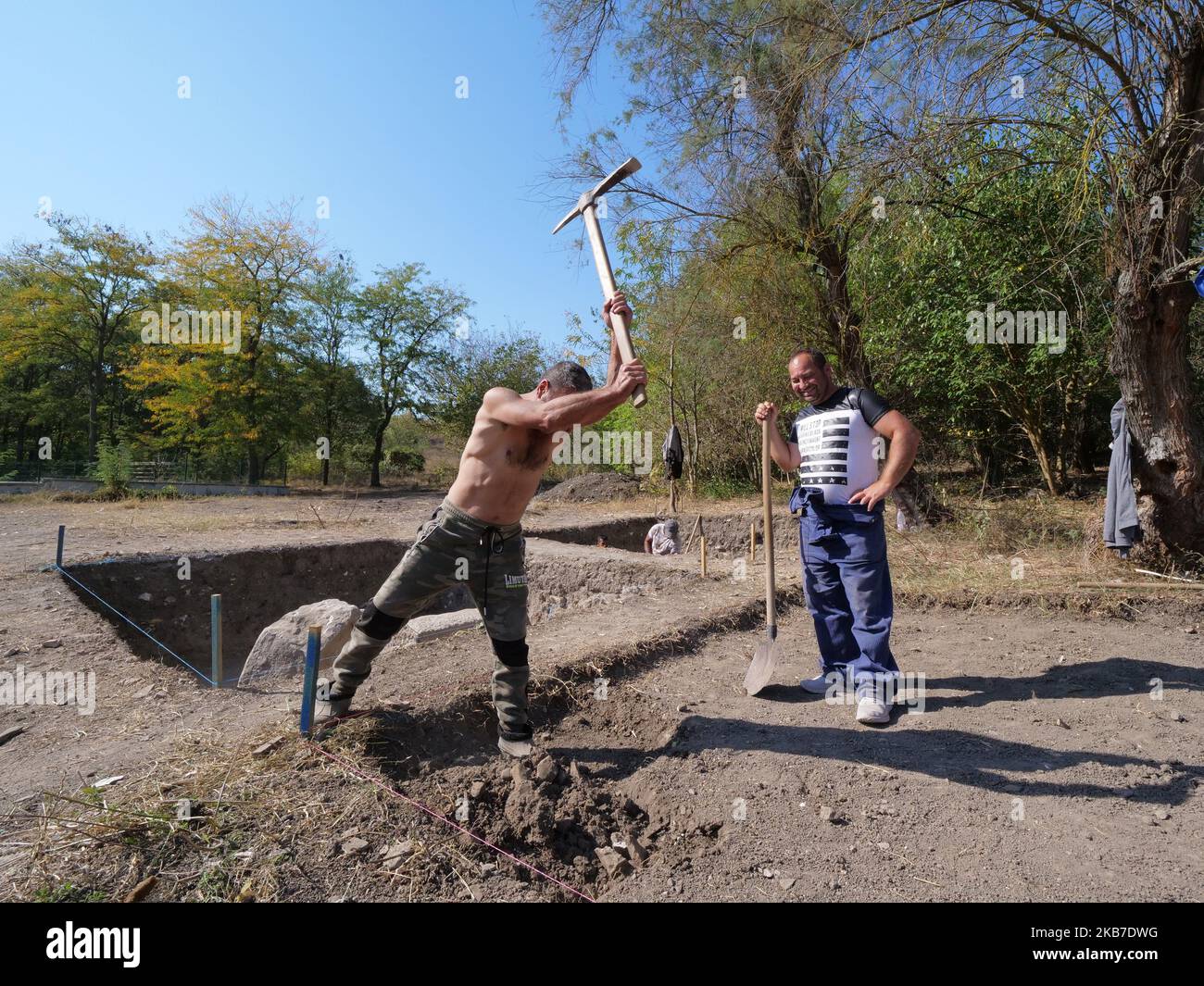 The archaeologist Hristo Kuzov shows golden coins, discovered during ...