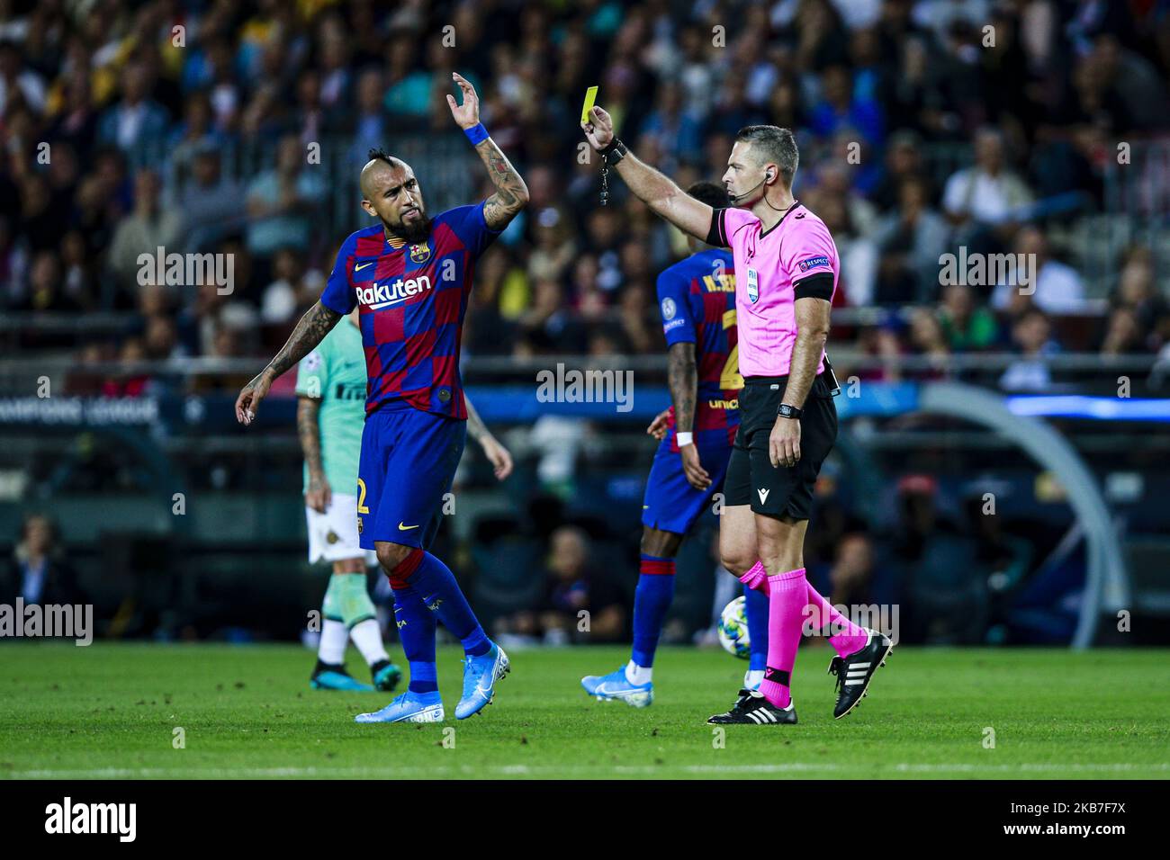 22 Arturo Vidal from Chile of FC Barcelona reciving a yellow card from ...