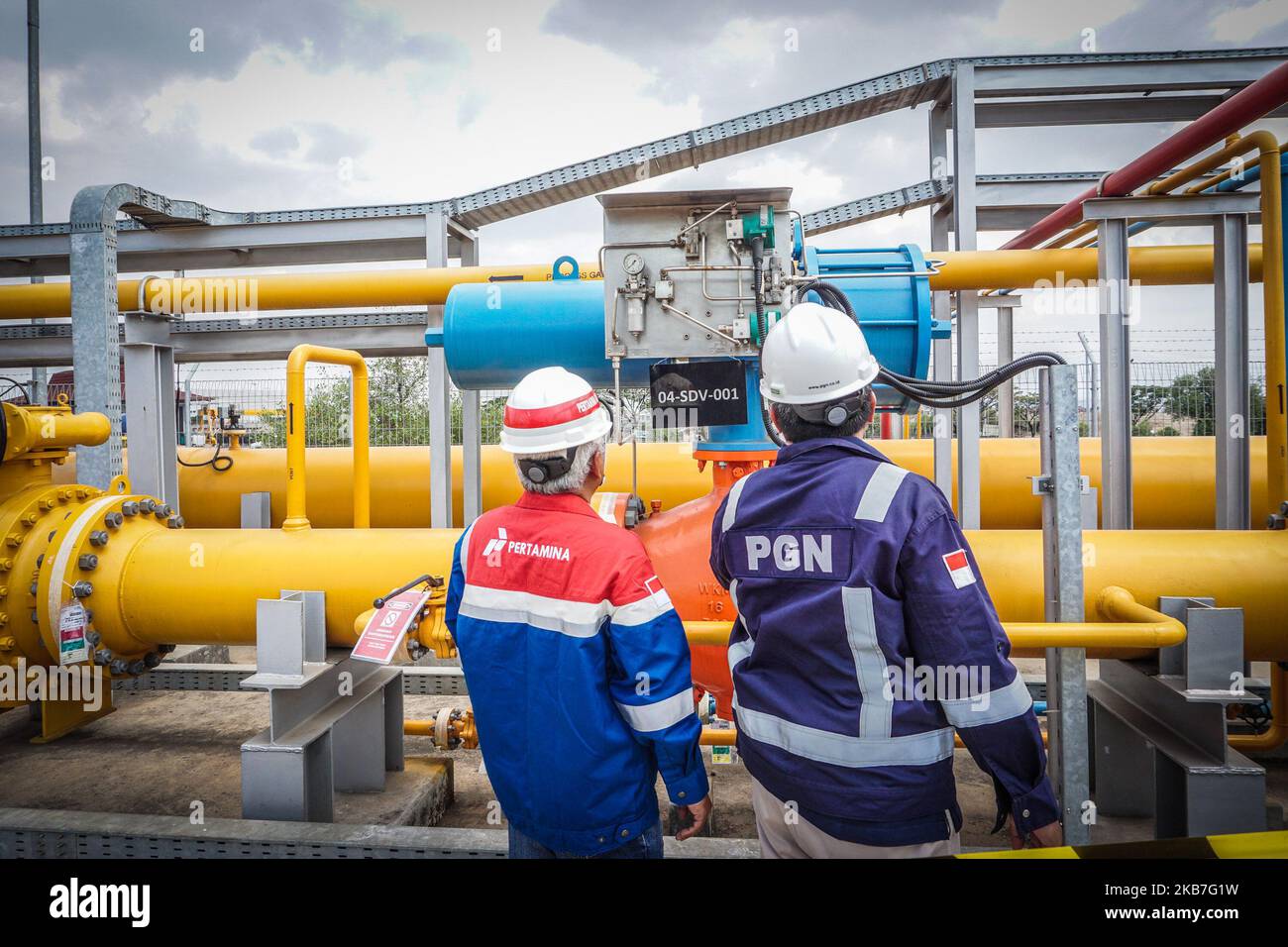 Employees inspect the installation of gas pipelines in the Onshore ...