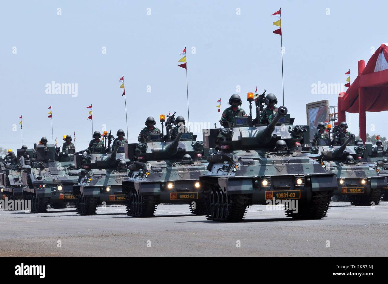 Indonesian National Armed Forces (TNI) soldiers mounted combat vehicles ...