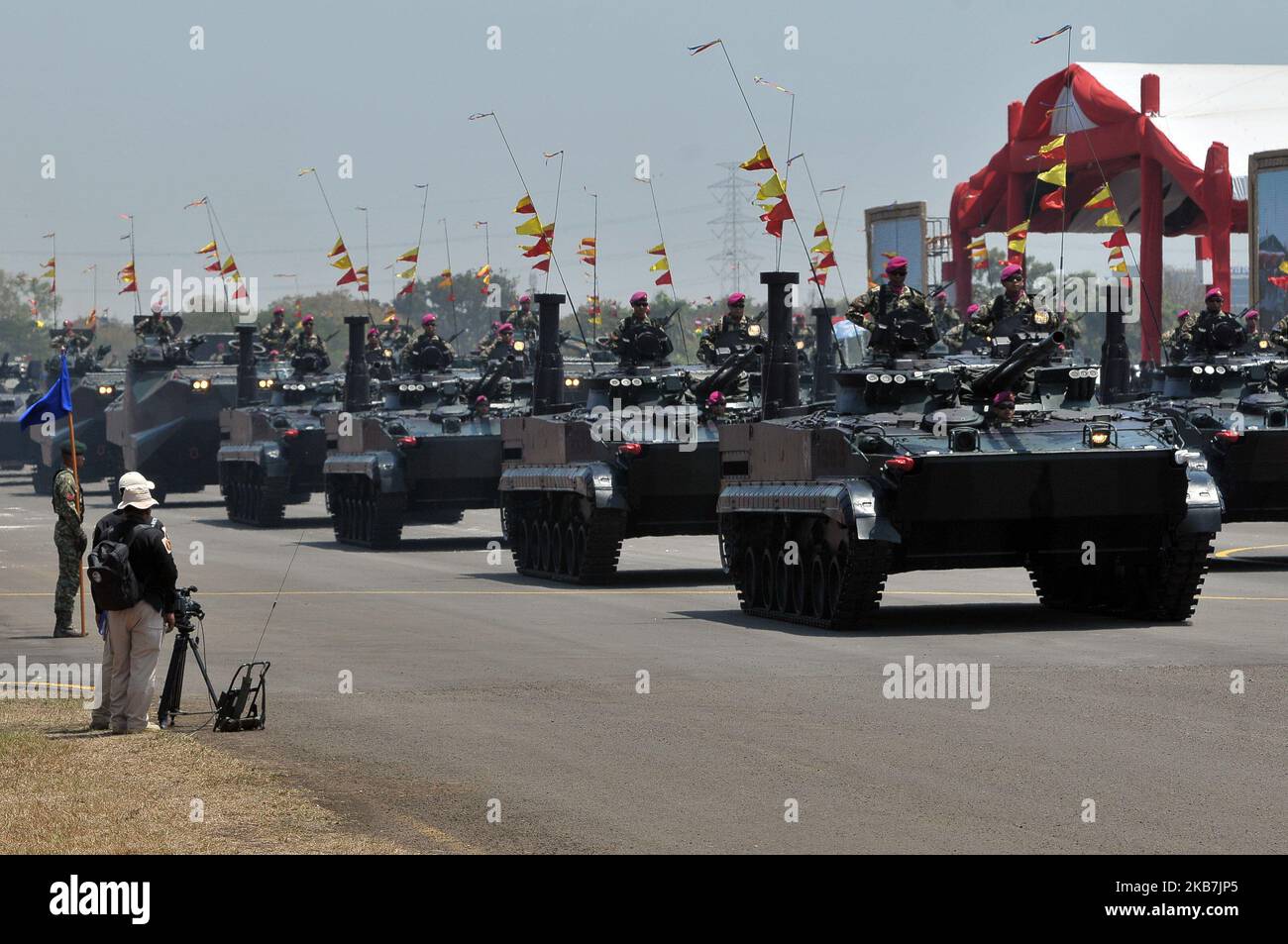 Indonesian National Armed Forces (TNI) soldiers mounted combat vehicles ...
