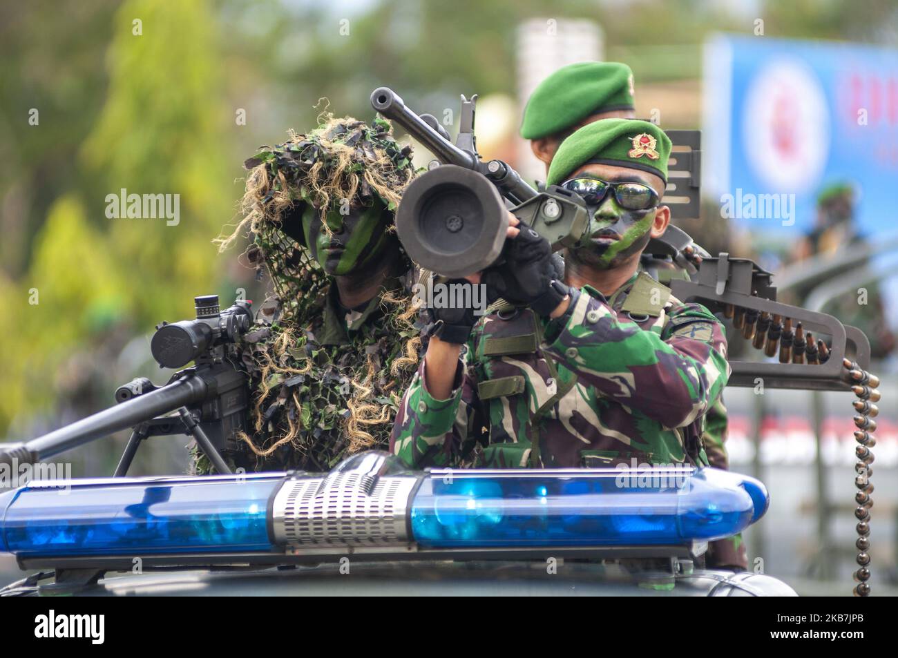 Troops carrying combat weapons during the devil at the 74th anniversary ...