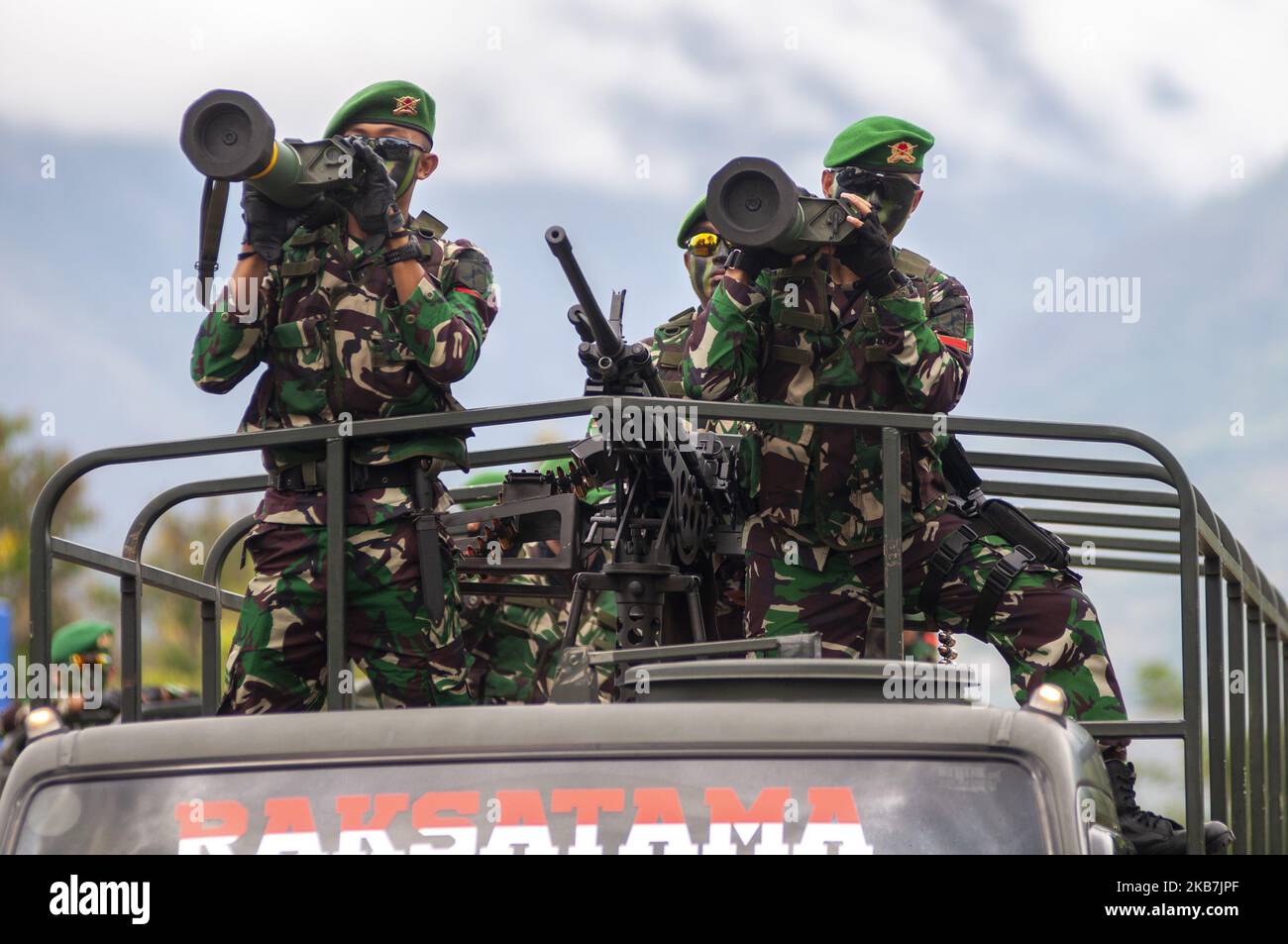 Troops carrying combat weapons during the devil at the 74th anniversary ...