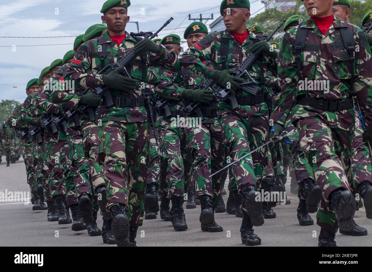 Troops marched during the devil at the 74th anniversary celebration of ...