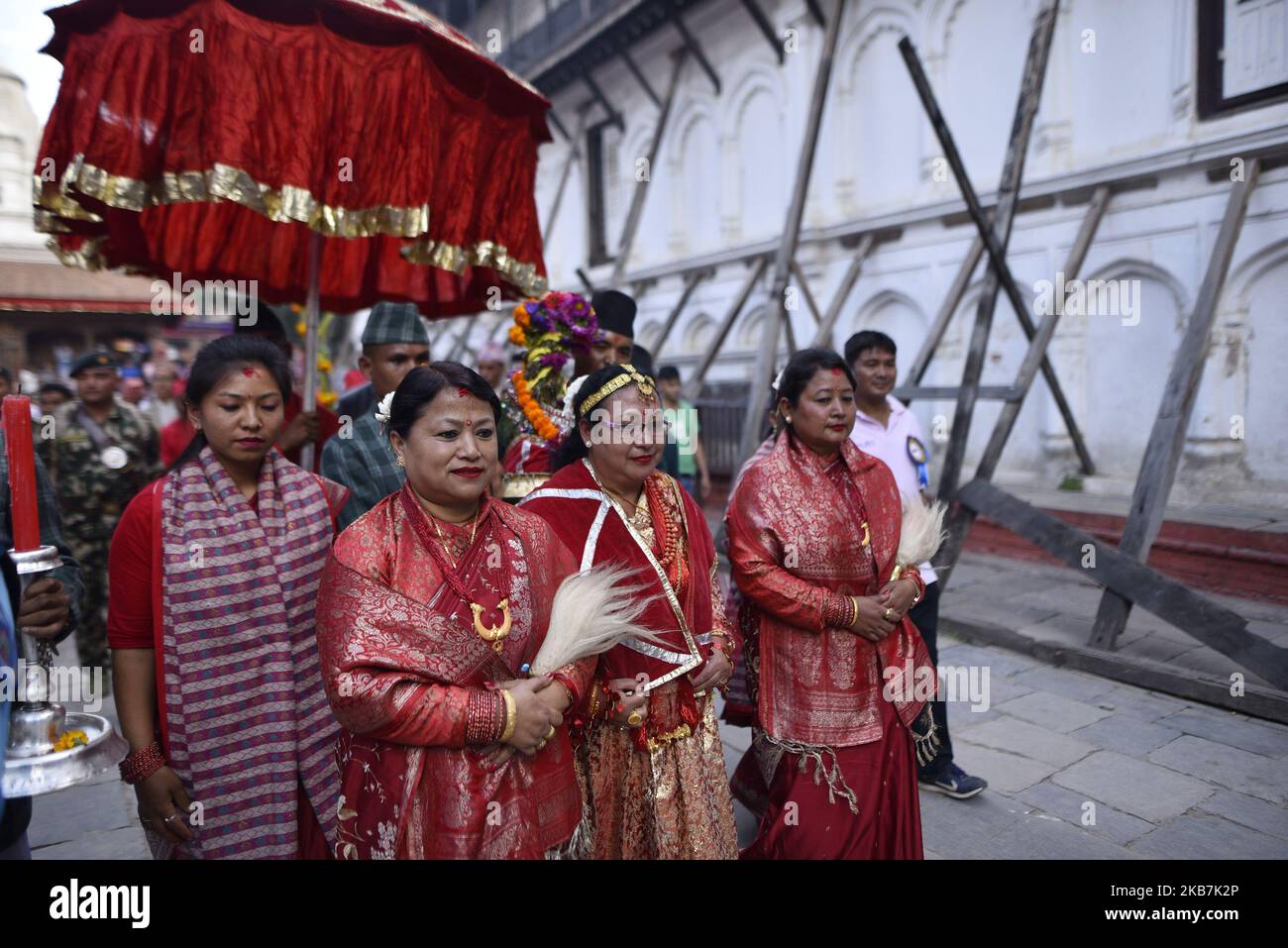 Nepalese devotees sings traditional songs as priests carrying Fulpati ...