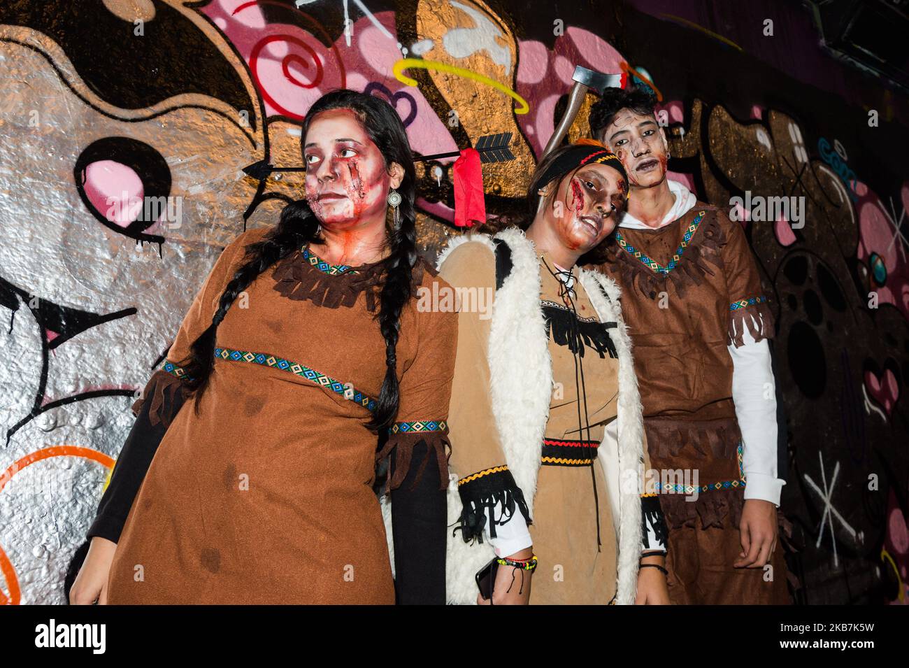 People wearing fancy dress costumes pose for photos ahead of 'Zombie ...