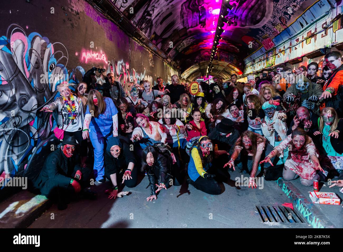 People wearing fancy dress costumes pose for photos ahead of 'Zombie ...