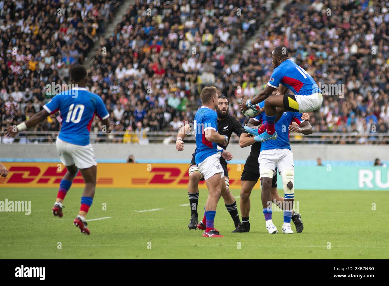Nambia's Lesley Klim (R) takes the high ball during the Rugby World Cup ...