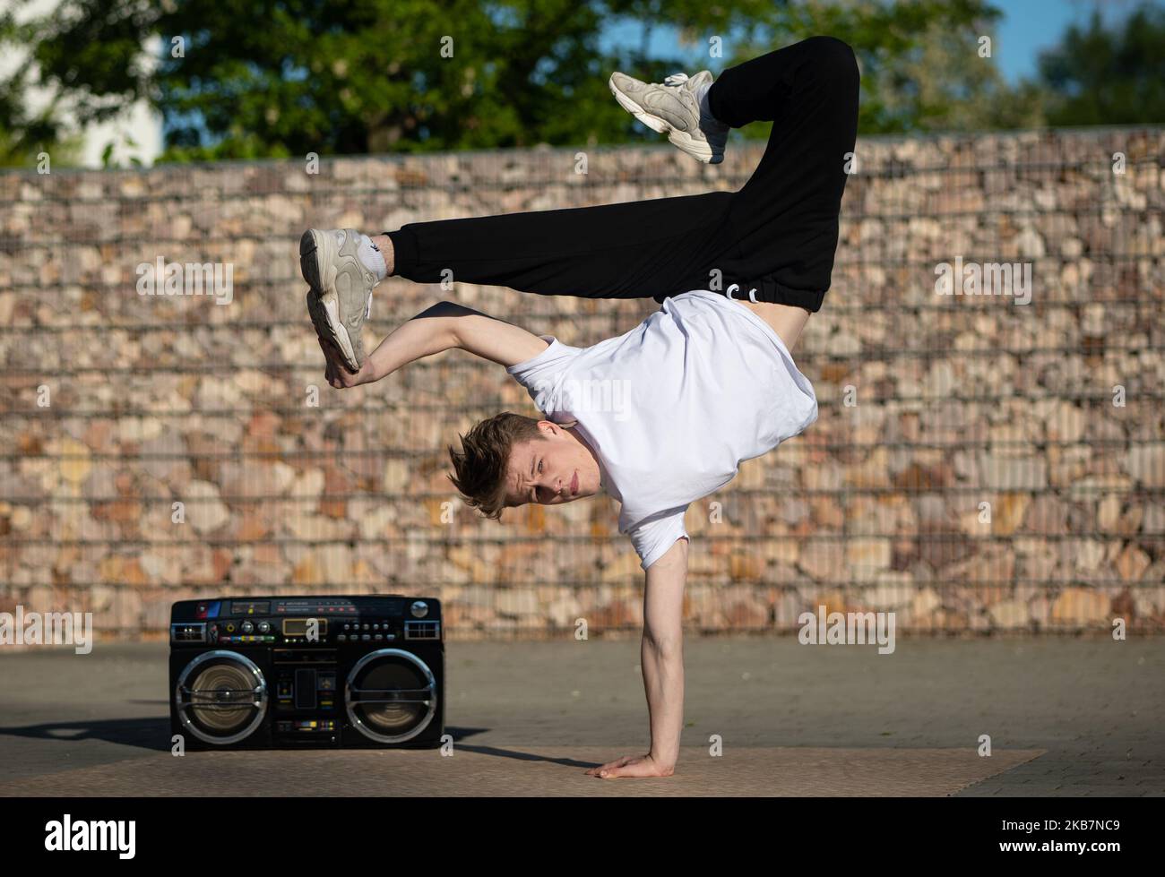 Breakdance dancer.A boy in breakdance position. A dancer in a difficult ...